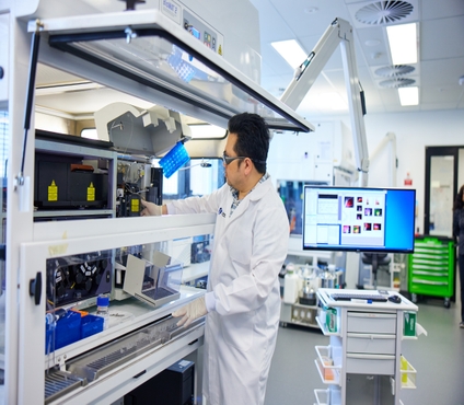 Man in lab working on equipment