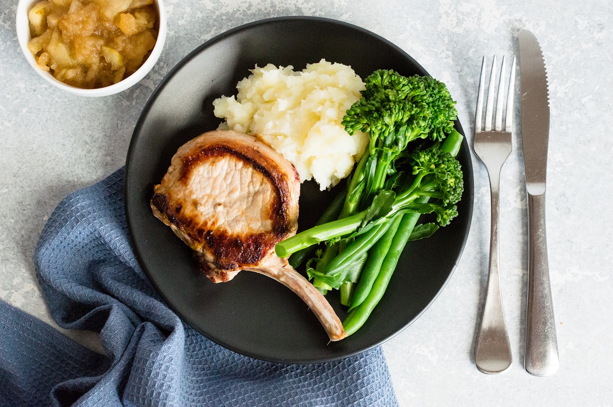 Grilled pork cutlet with homemade apple sauce, mashed potato and ...