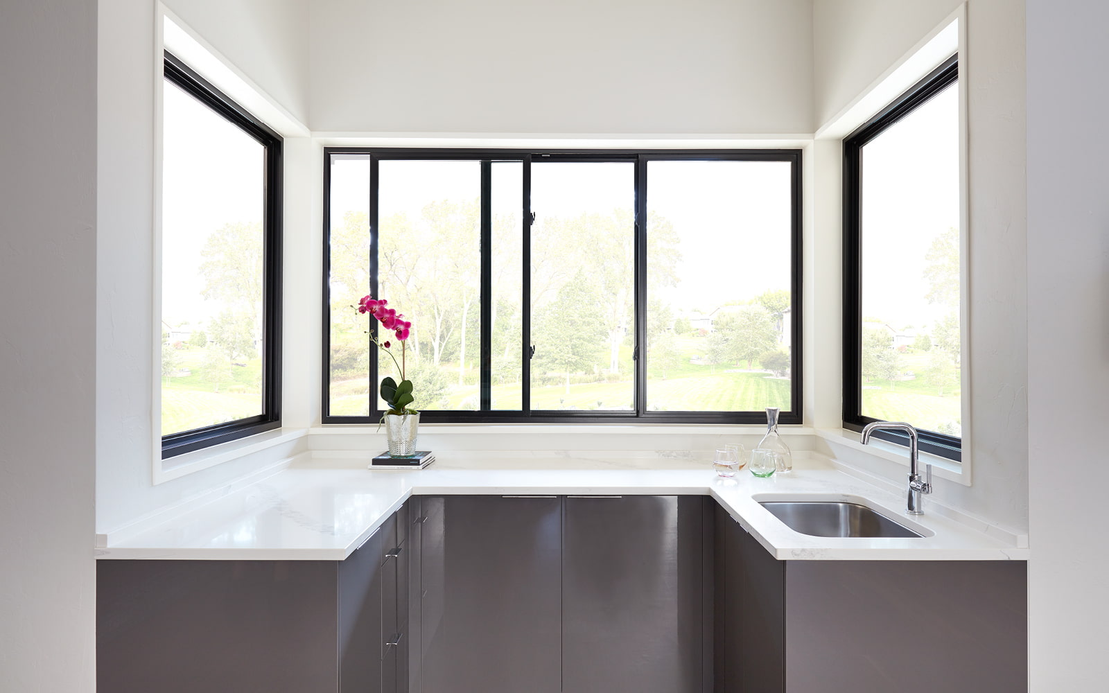 a dining room table surrounded by fiberglass windows
